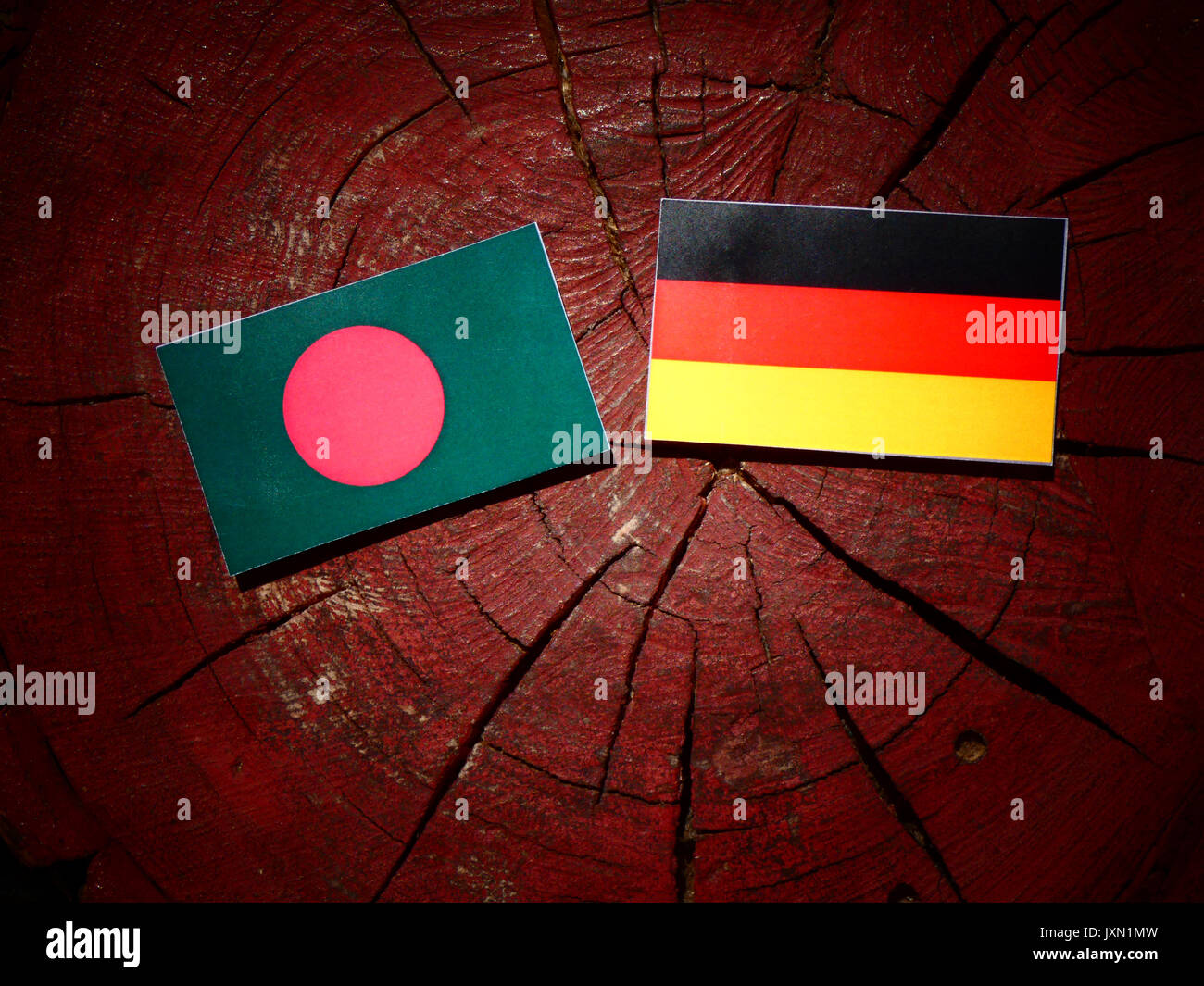 Bangladesh flag with German flag on a tree stump isolated Stock Photo ...