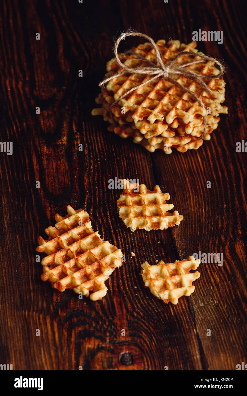 Stack of Waffles and Waffle Pieces on Wooden Surface. Vertical ...