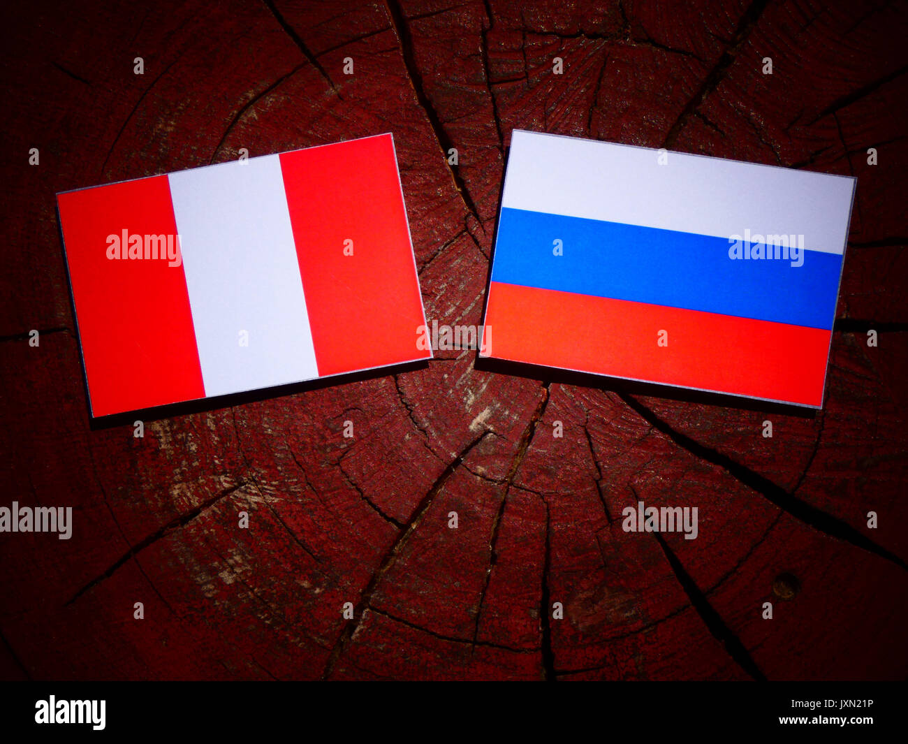Peruvian flag with Russian flag on a tree stump isolated Stock Photo ...