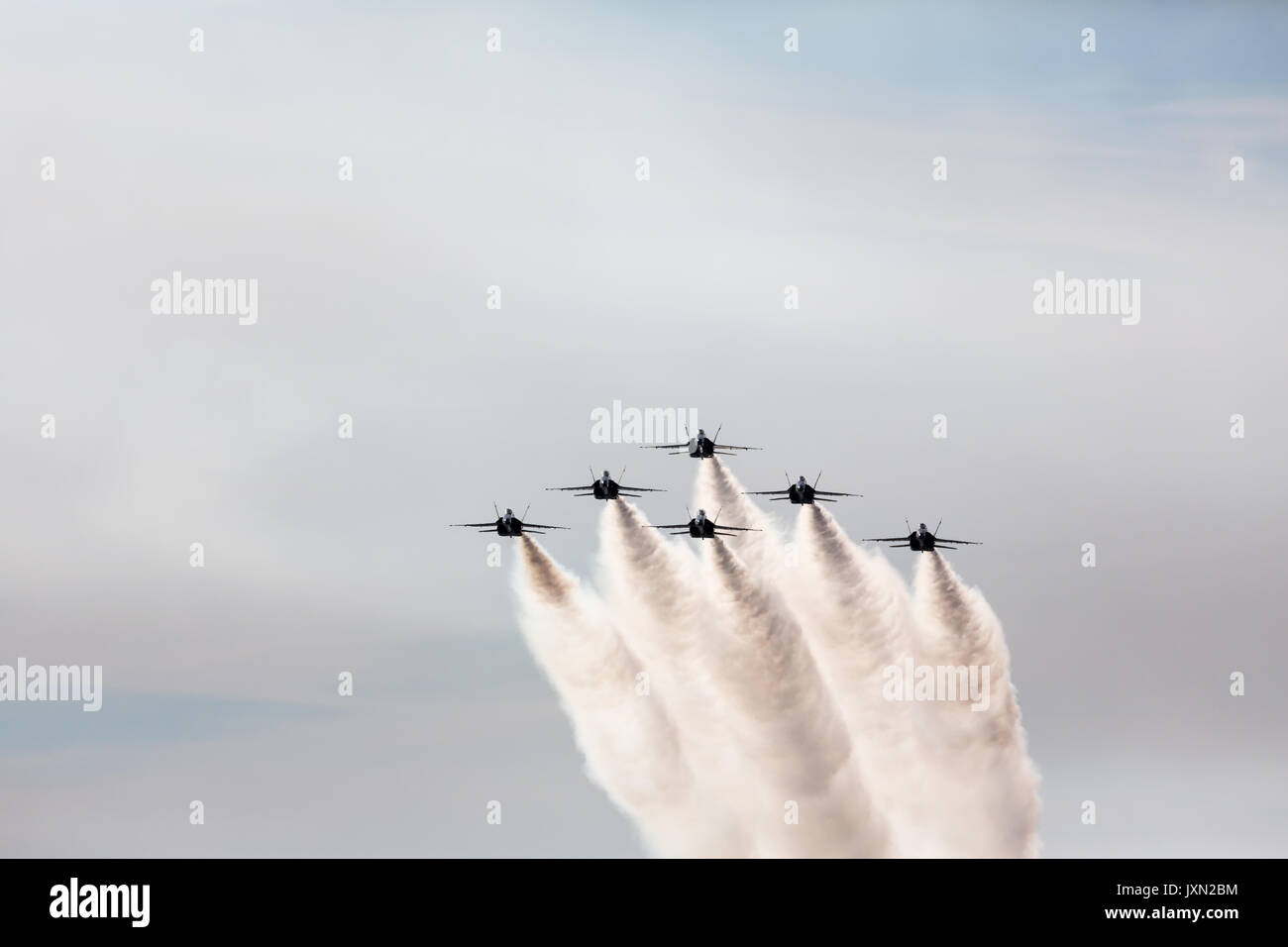 Blue Angels jet aircraft fly in formation with smoke trails Stock Photo ...
