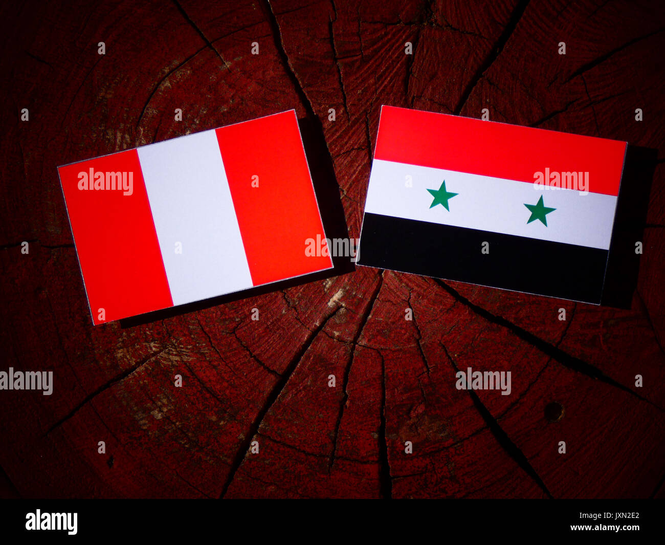 Peruvian flag with Syrian flag on a tree stump isolated Stock Photo - Alamy