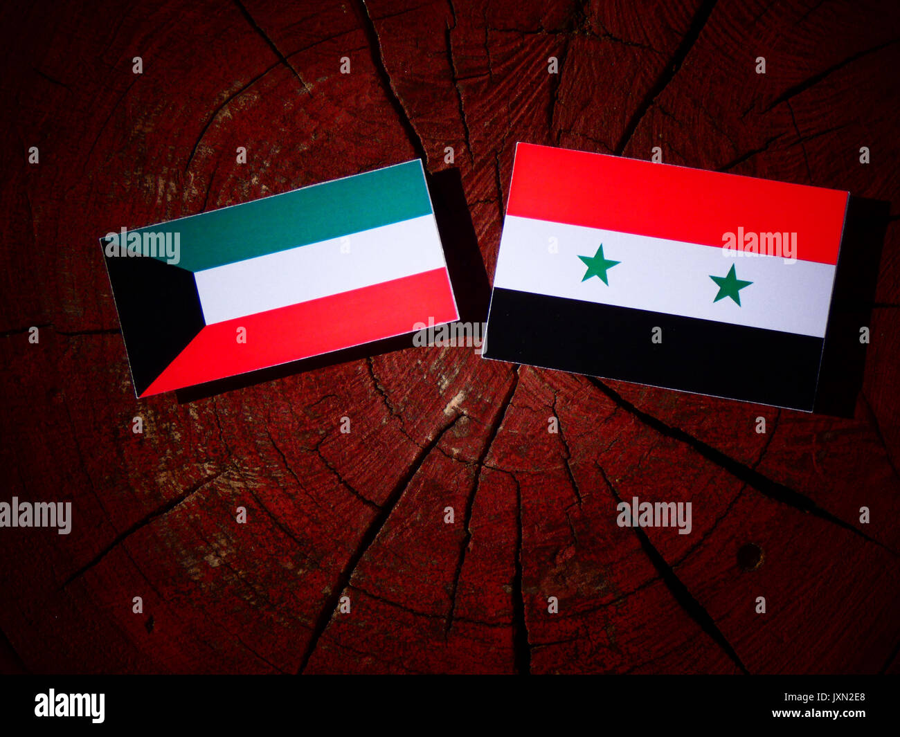 Kuwaiti flag with Syrian flag on a tree stump isolated Stock Photo - Alamy