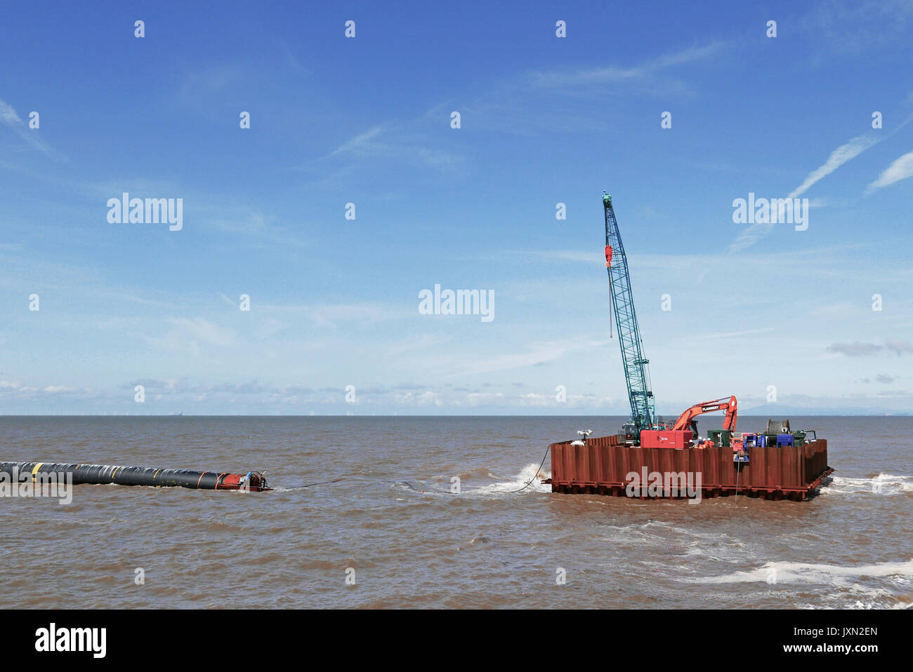 Cofferdam containing cranes and earth moving equipment working on n ...