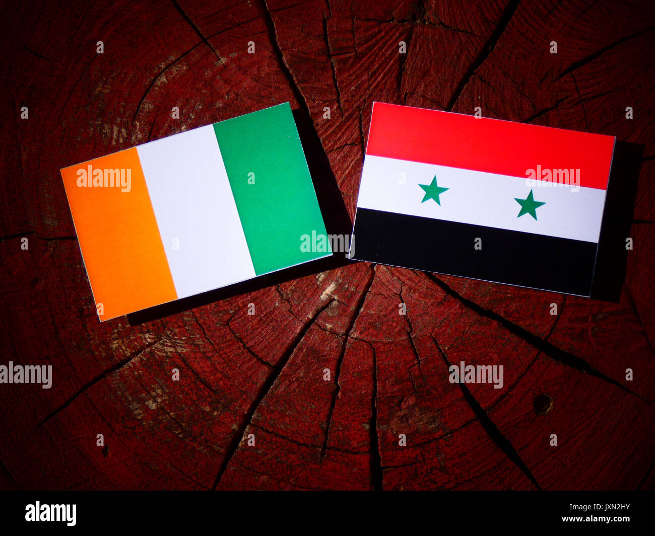 Ivory Coast flag with Syrian flag on a tree stump isolated Stock Photo ...