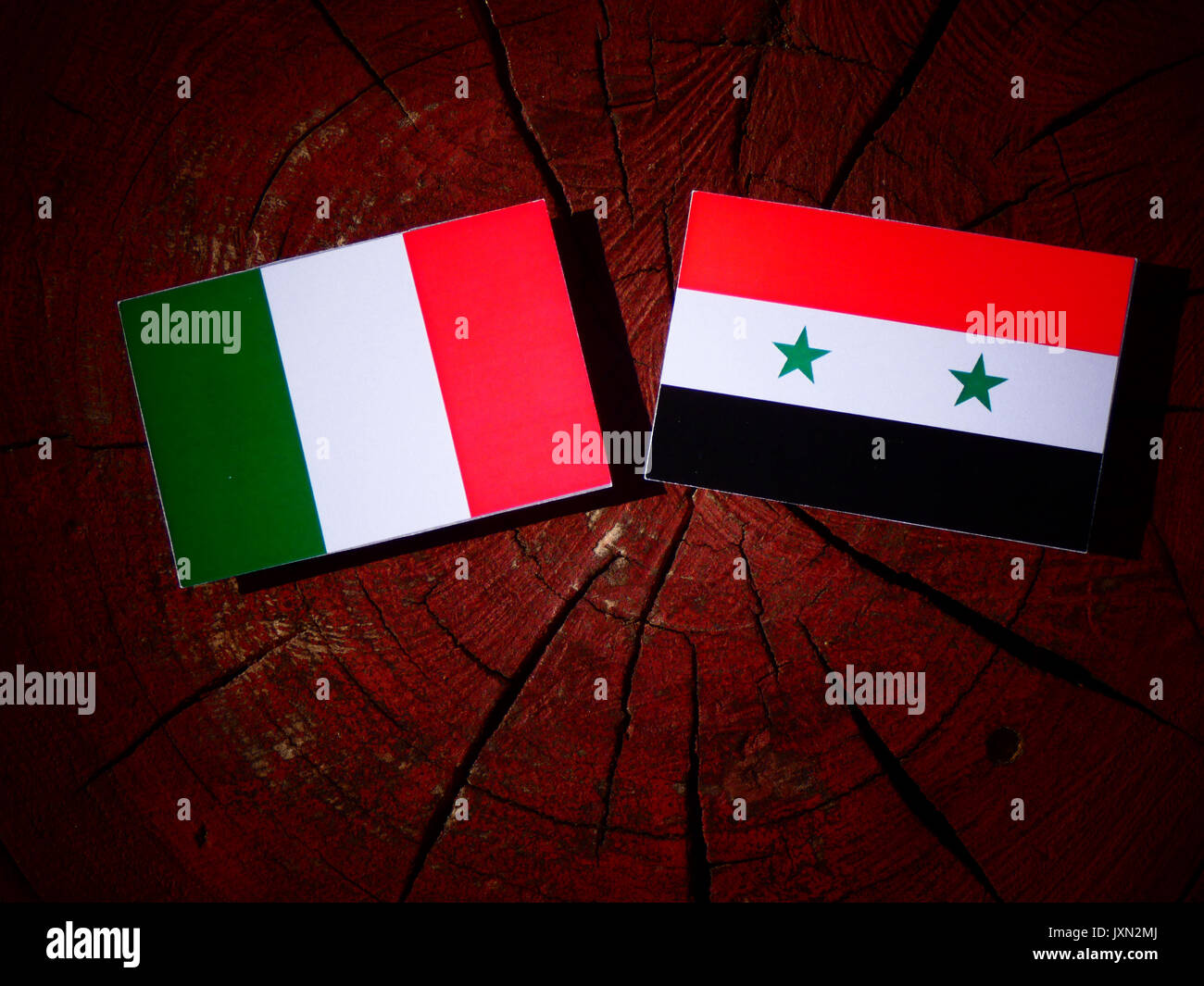 Italian flag with Syrian flag on a tree stump isolated Stock Photo - Alamy