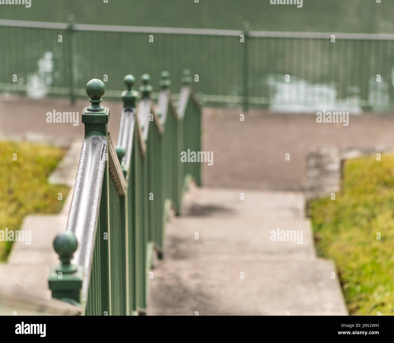 Ball on Post of Green Railing along concrete stairs Stock Photo - Alamy