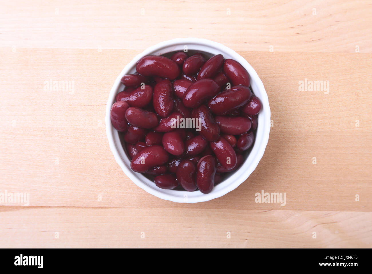 Heap of canned red kidney beans in the sauce in white bowl. vegetarian ...