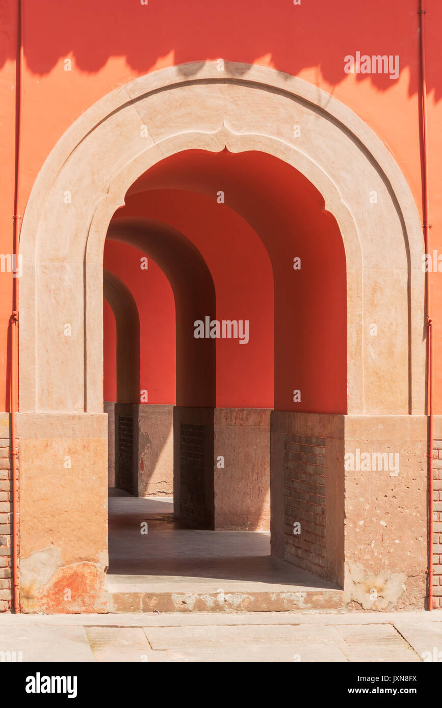 Entry of a red arch corridor in a chinese gate Stock Photo - Alamy