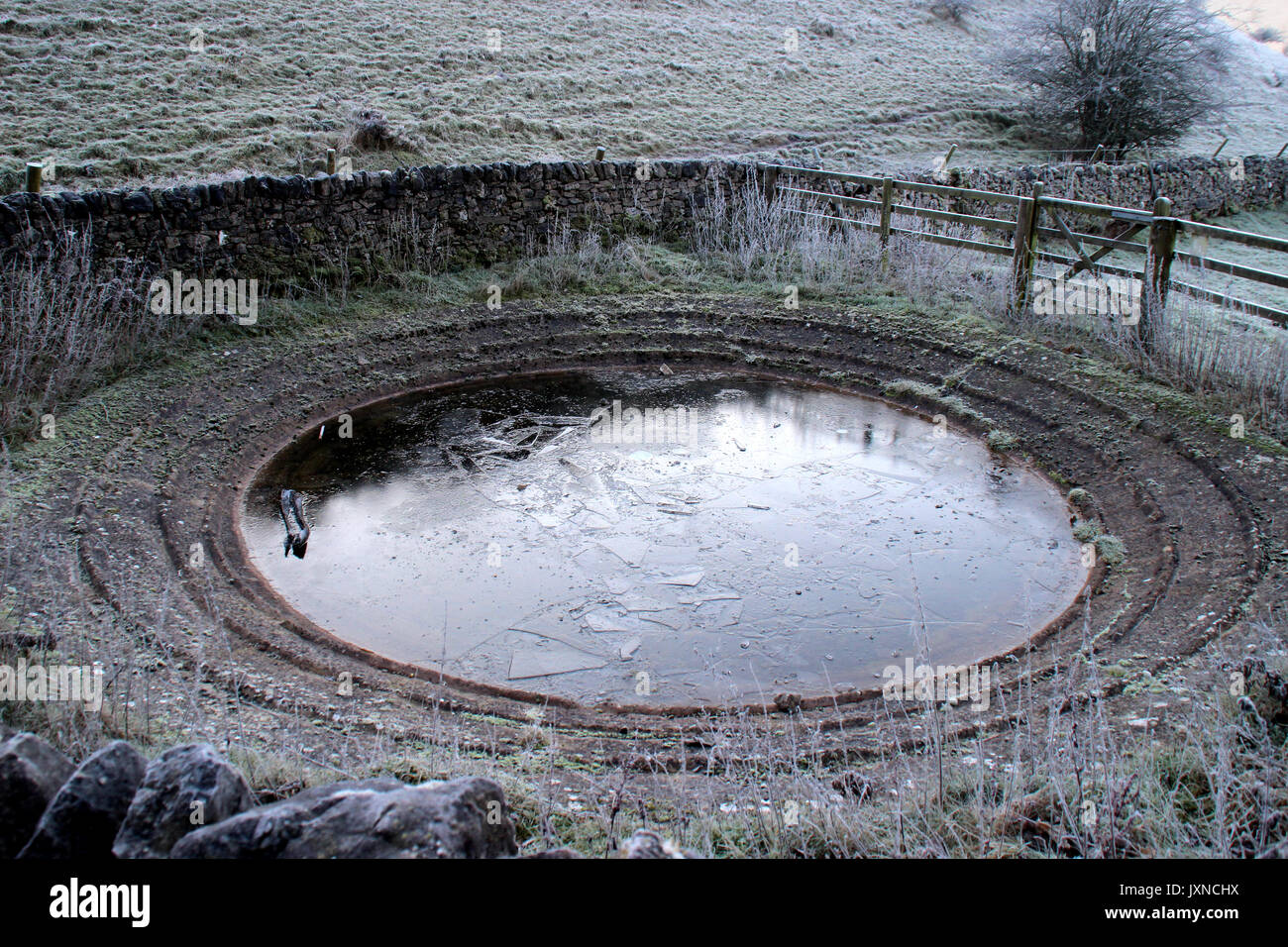 Icy Dew Pond in the Peak District in Winter Stock Photo - Alamy