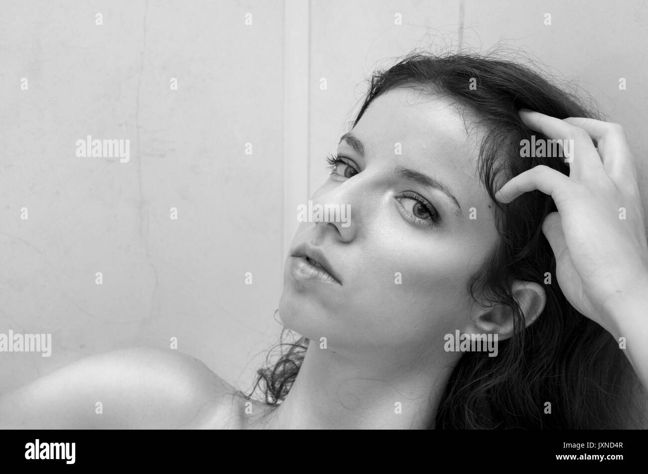 Attractive woman glancing at the camera Stock Photo - Alamy