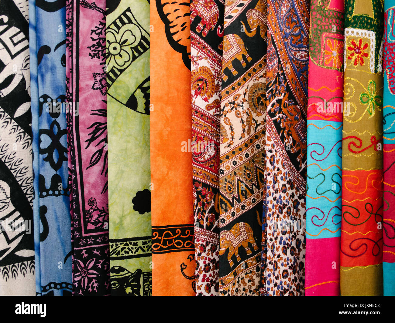 Collection of fabrics at a market Stock Photo - Alamy
