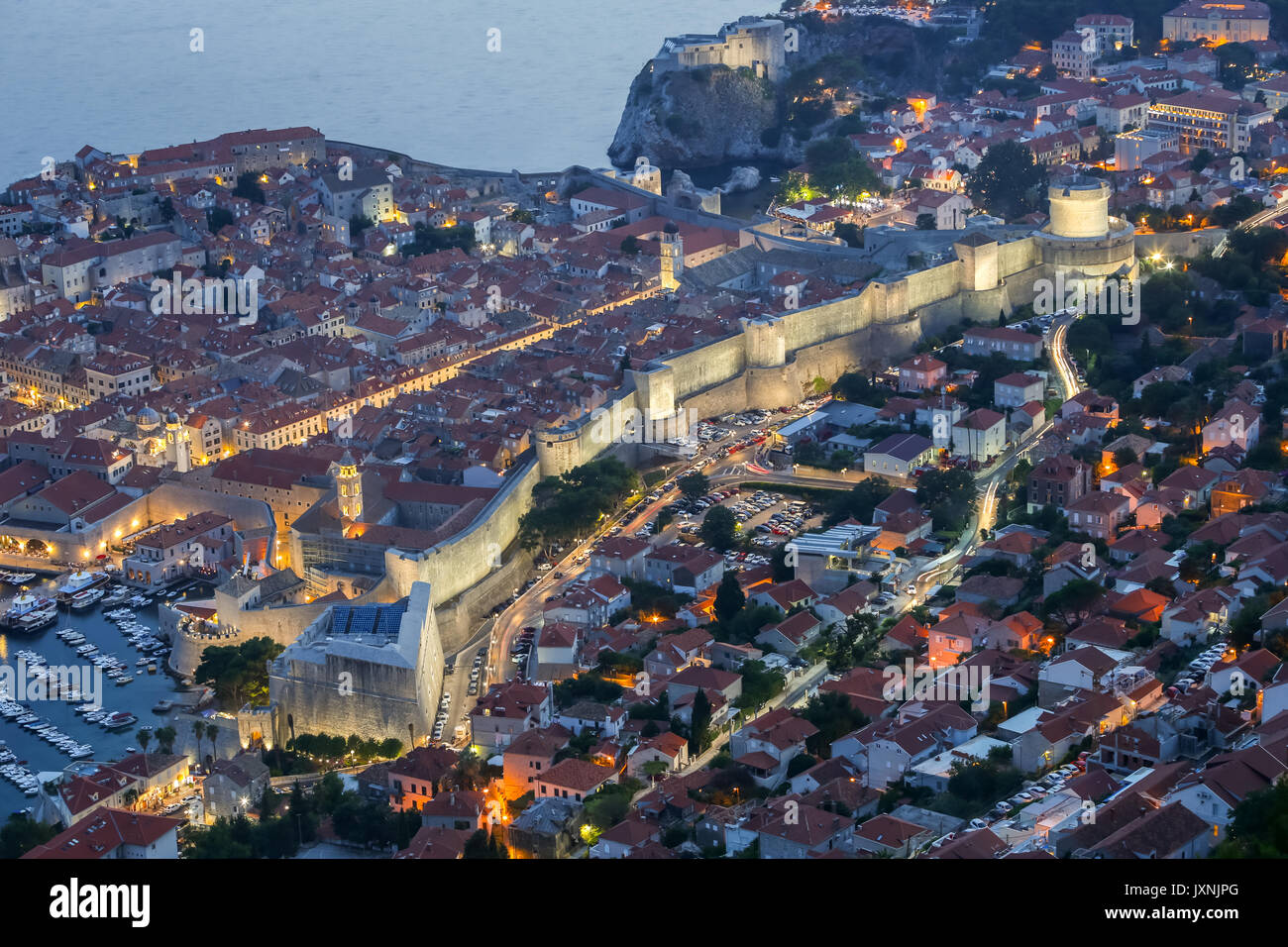 An aerial view of the ancient old town walls of Dubrovnik at sunset in ...