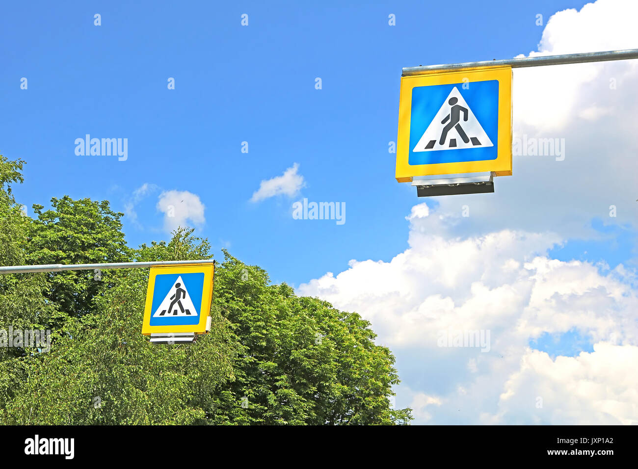 Road signs pedestrian crossing on background of trees Stock Photo - Alamy