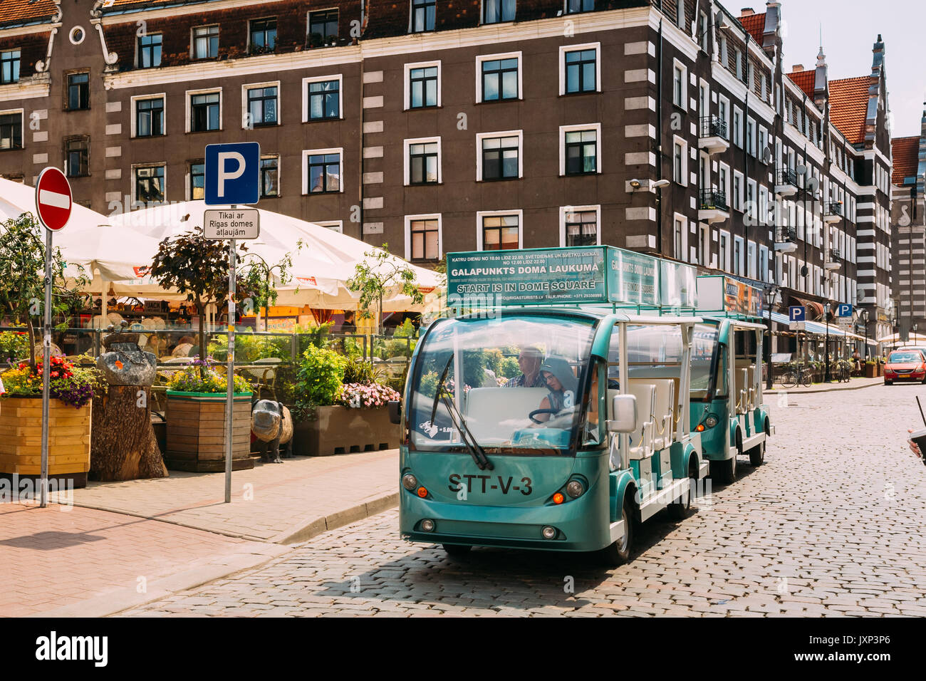 Riga, Latvia - July 2, 2016: Electric Car With Tourists People For ...