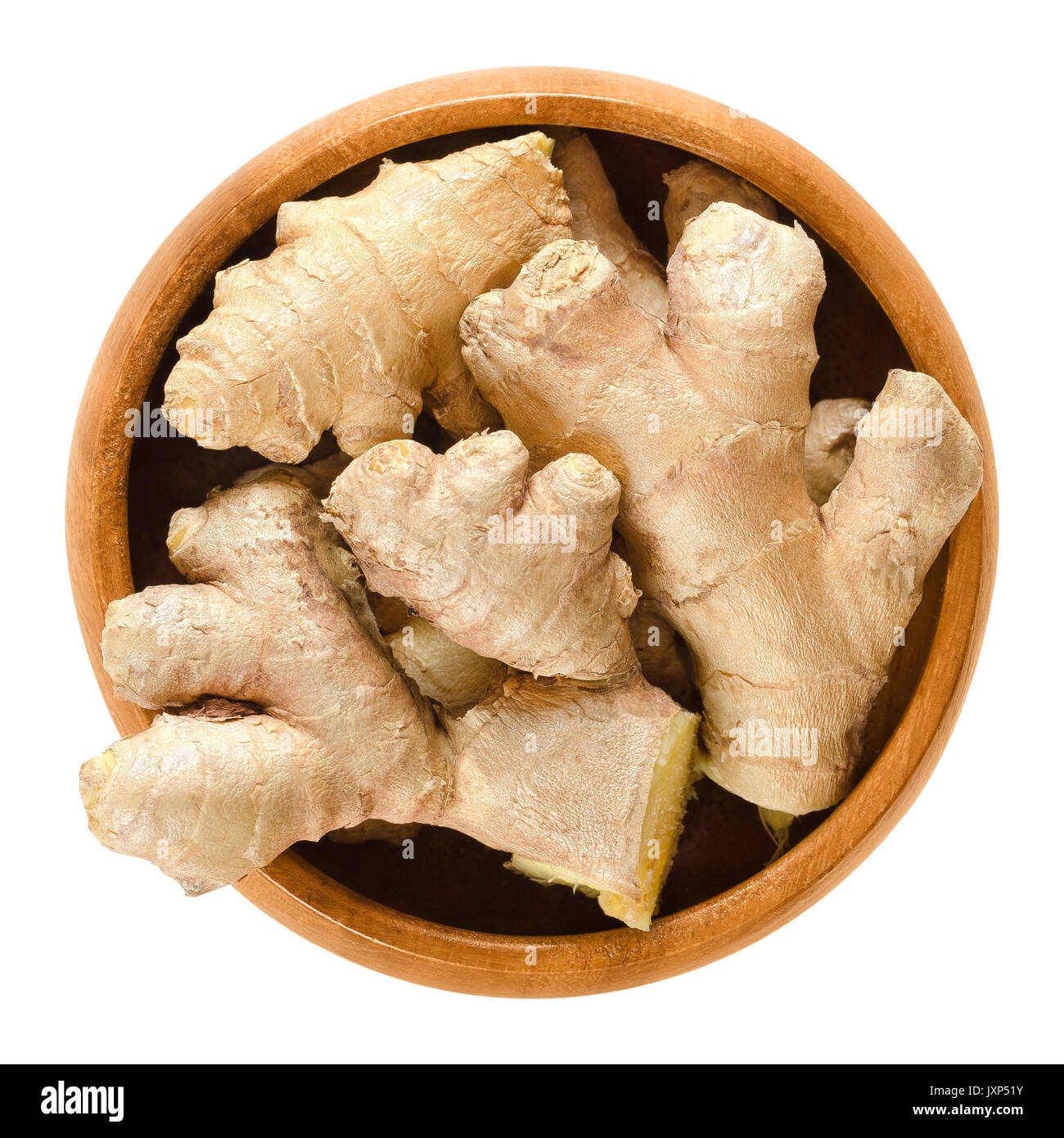 Ginger roots in wooden bowl. Fresh rhizomes of Zingiber officinale ...