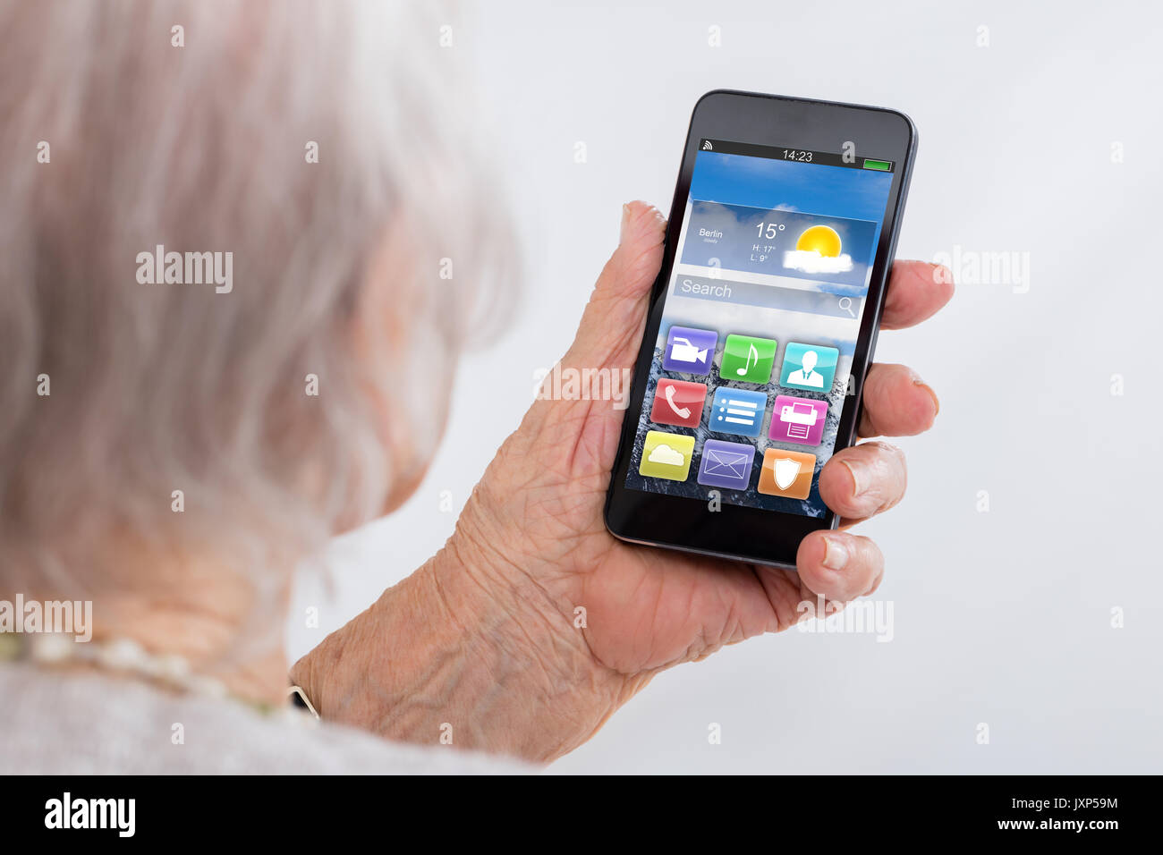 Senior citizen using smartphone hi-res stock photography and images - Alamy