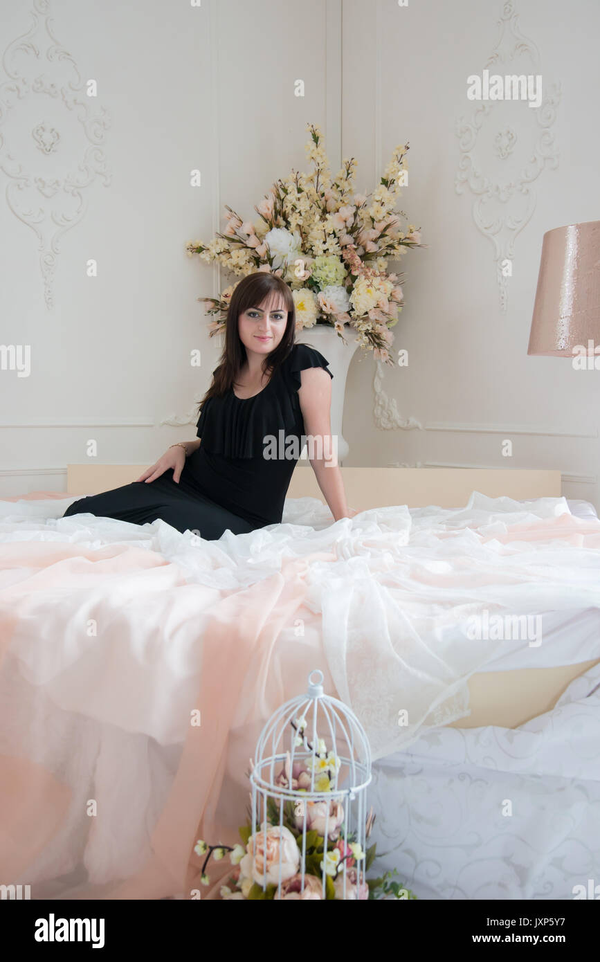 Charming young girl on a studio photo shoot Stock Photo - Alamy