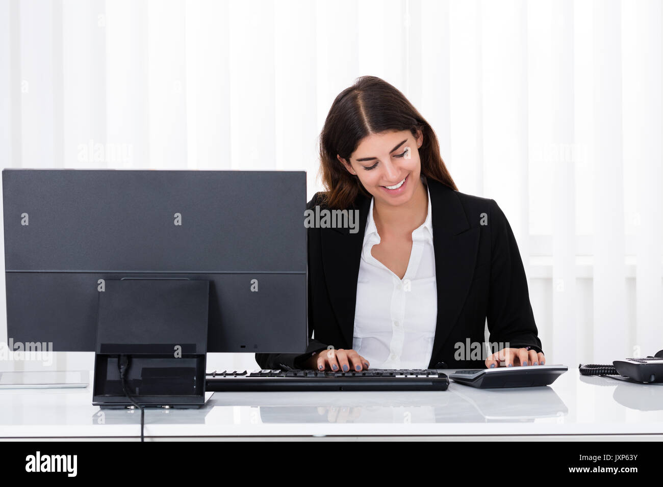 Tax accountant working calculator hi-res stock photography and images ...