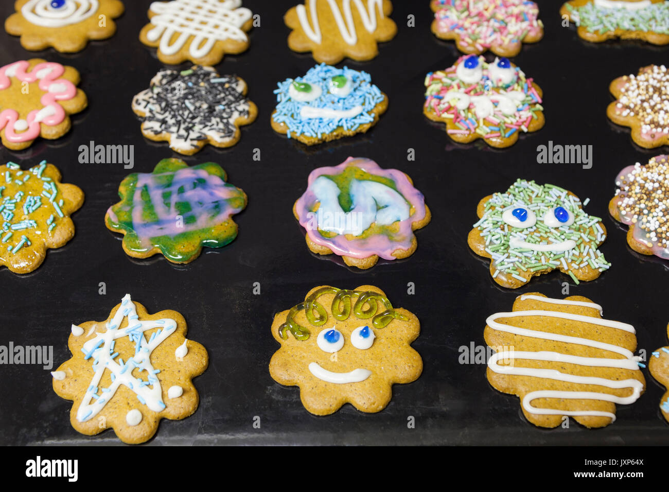 Lots of freshly made homemade gingerbread man ginger cookies decorated ...
