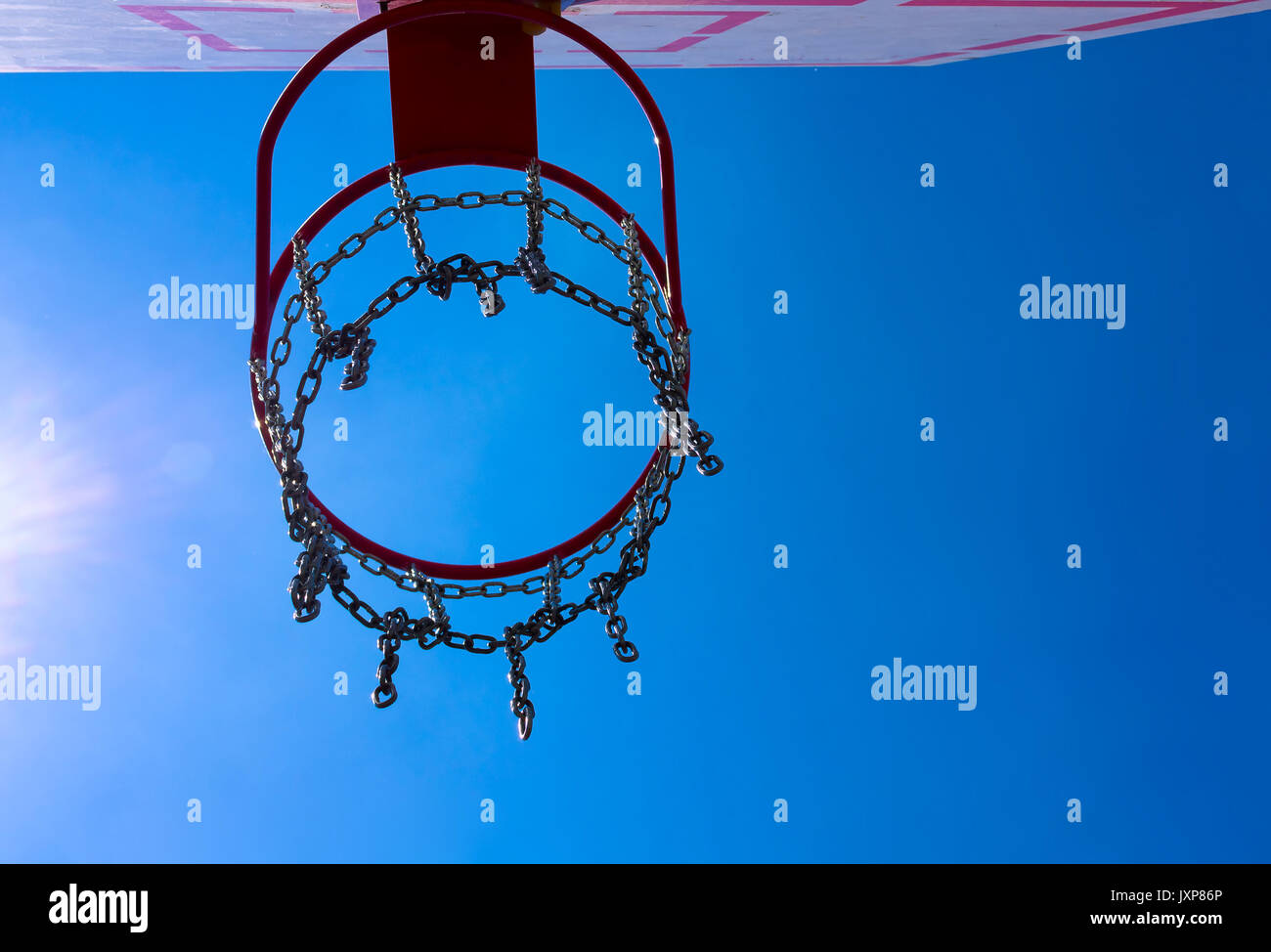Outdoor basketball hoop with blue sky Stock Photo - Alamy