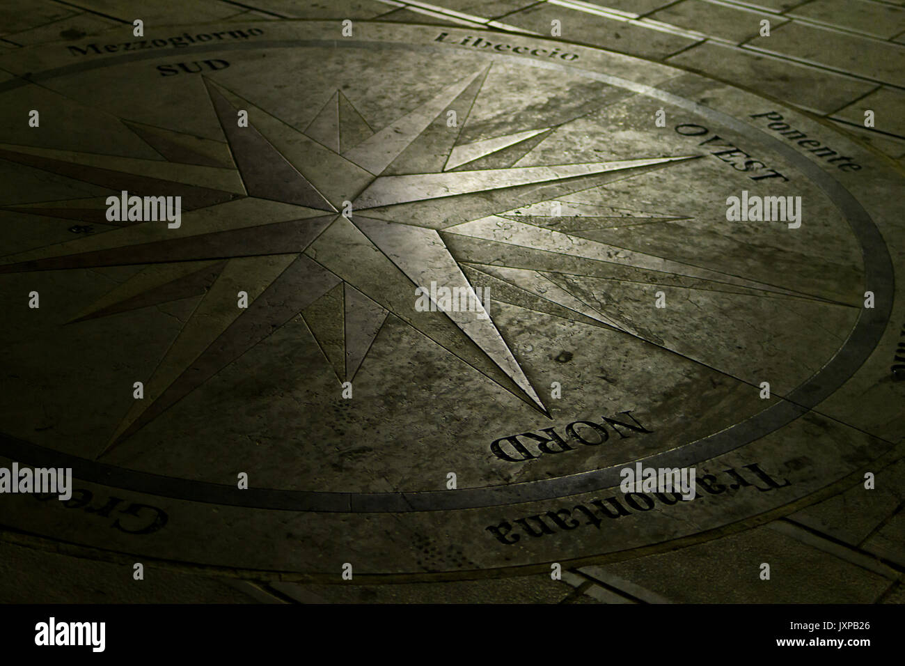 Compass Rose on a pavement in Castro (Italy) at night. Landscape format ...