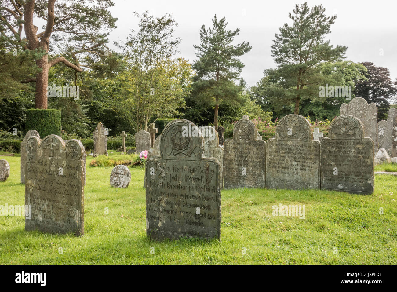 Ornate ancient graves with inscriptions in the church cemetery at ...