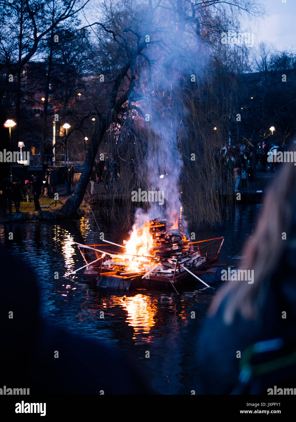 Small pyre on a raft in a river Stock Photo - Alamy