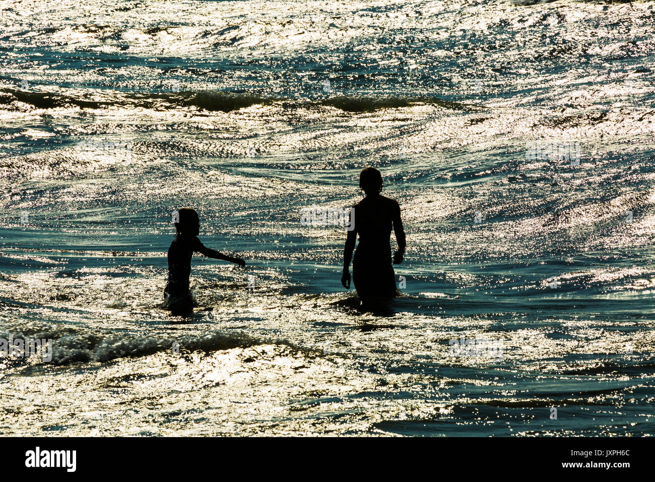 Kids swimming big waves hi-res stock photography and images - Alamy