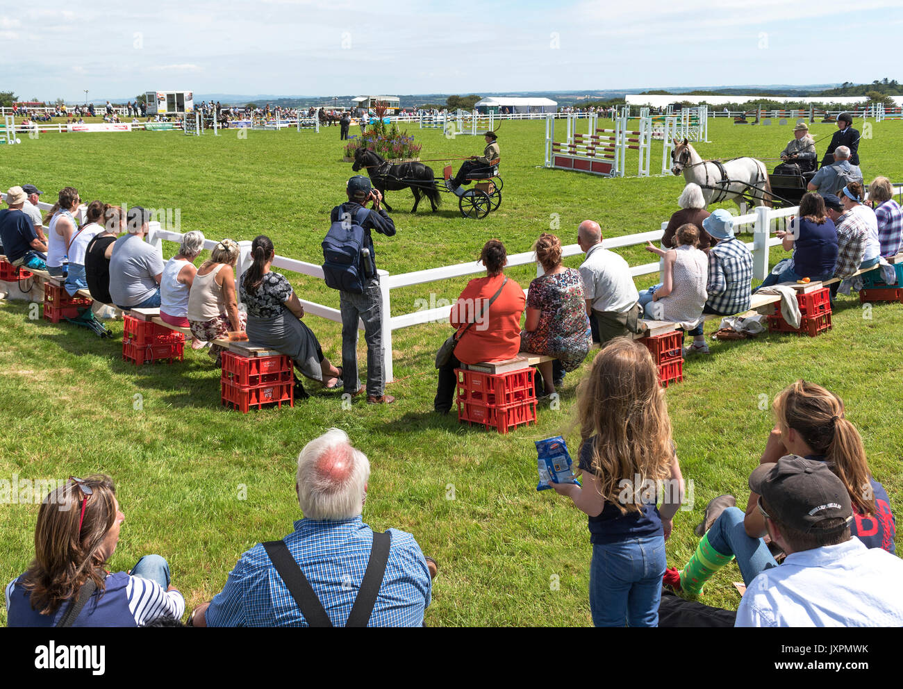 people watching equine event in the showring at a country fair in ...