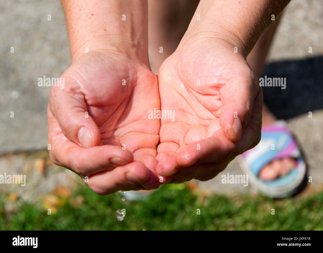 Human hands splashing pure water hi-res stock photography and images ...