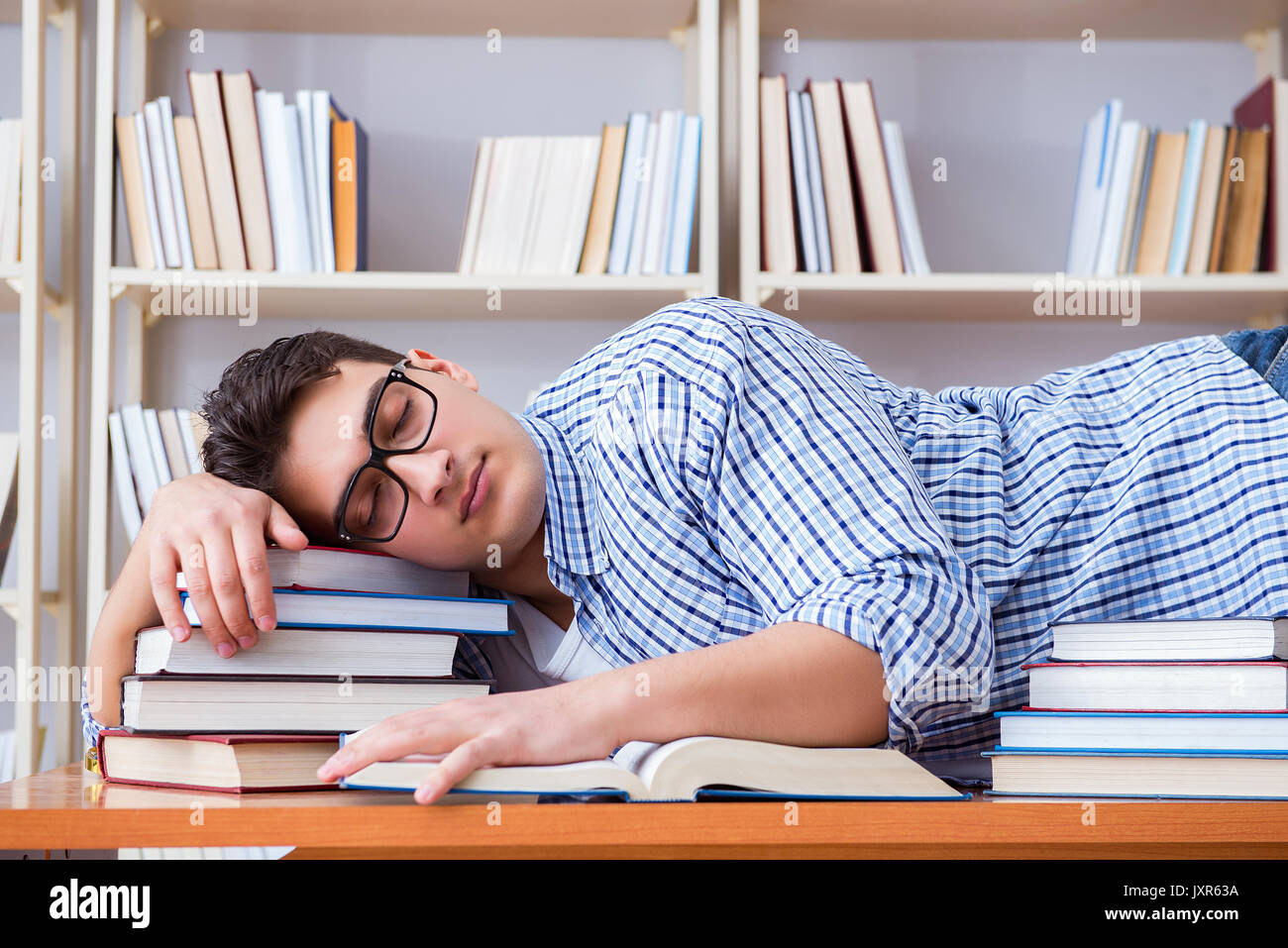Young student taking break and falling asleep Stock Photo - Alamy
