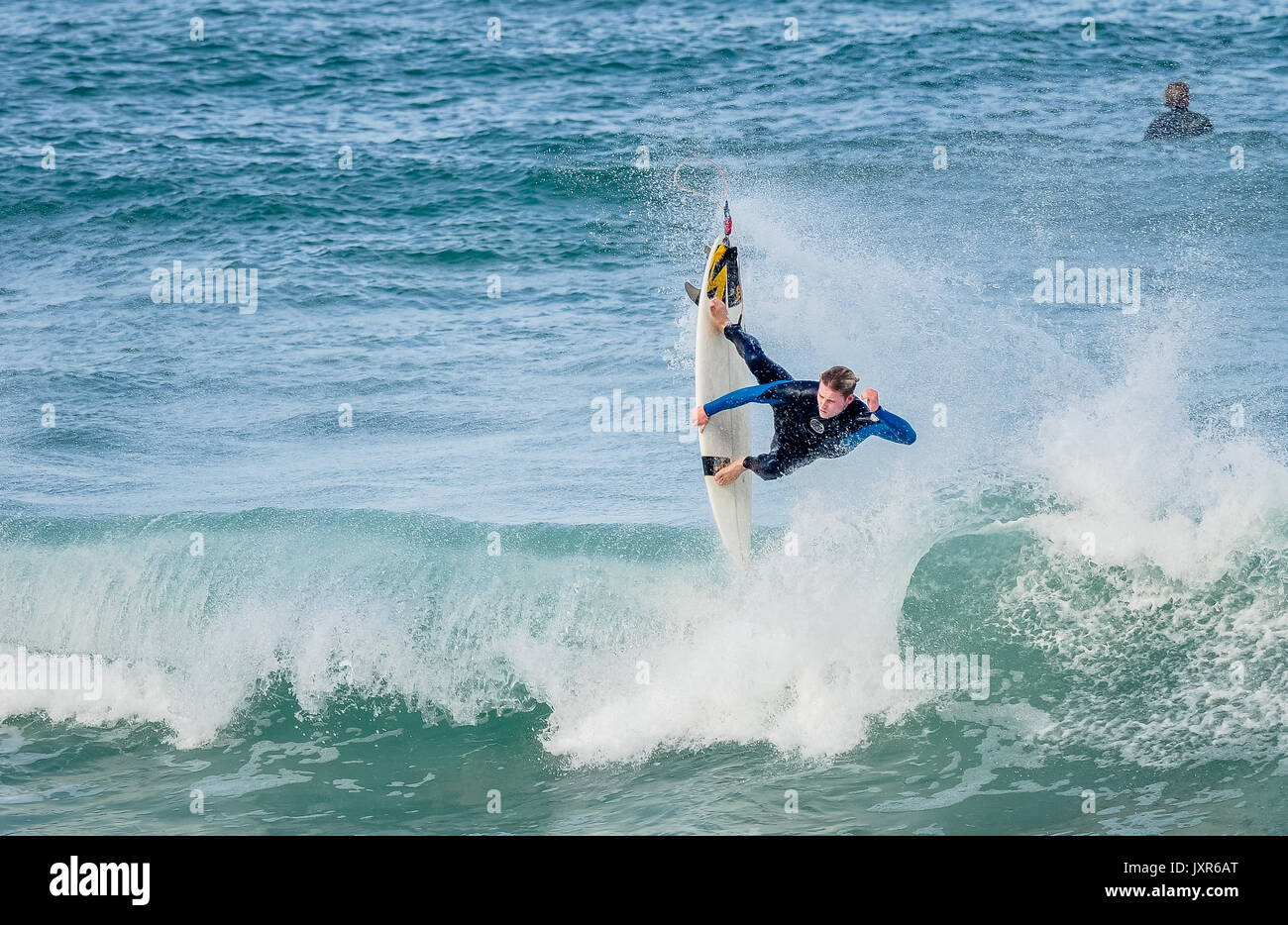 Mid adult male surfing on a wave in Cornwall, England, UK Stock Photo ...