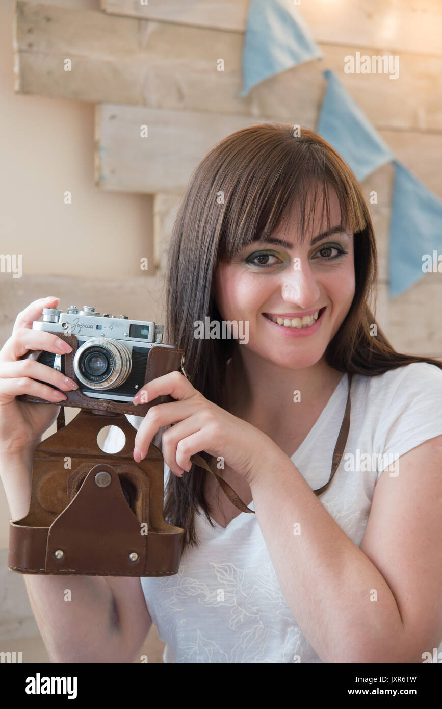 Charming young girl on a studio photo shoot Stock Photo - Alamy