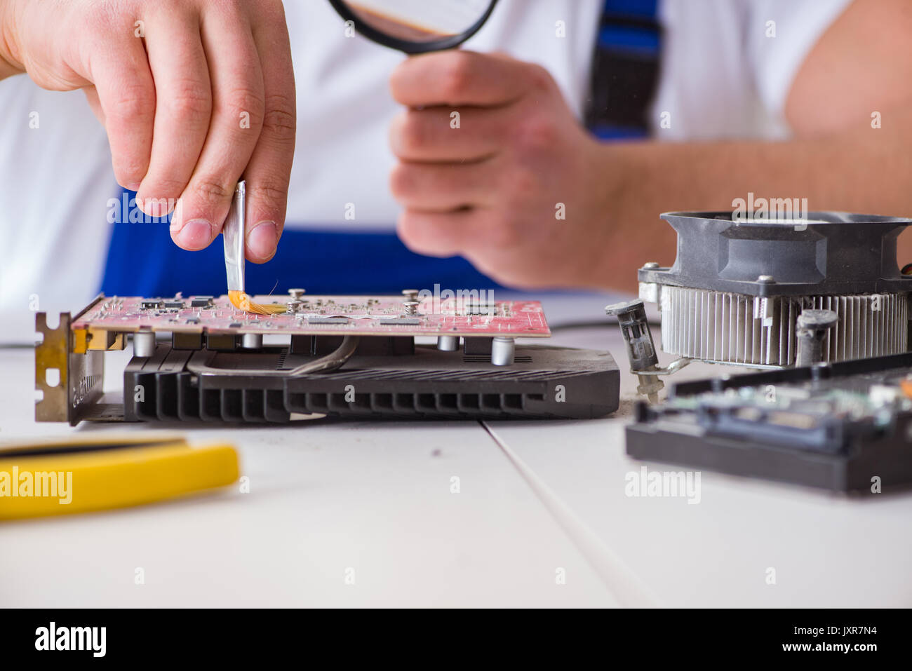 Computer repairman repairing desktop computer Stock Photo - Alamy