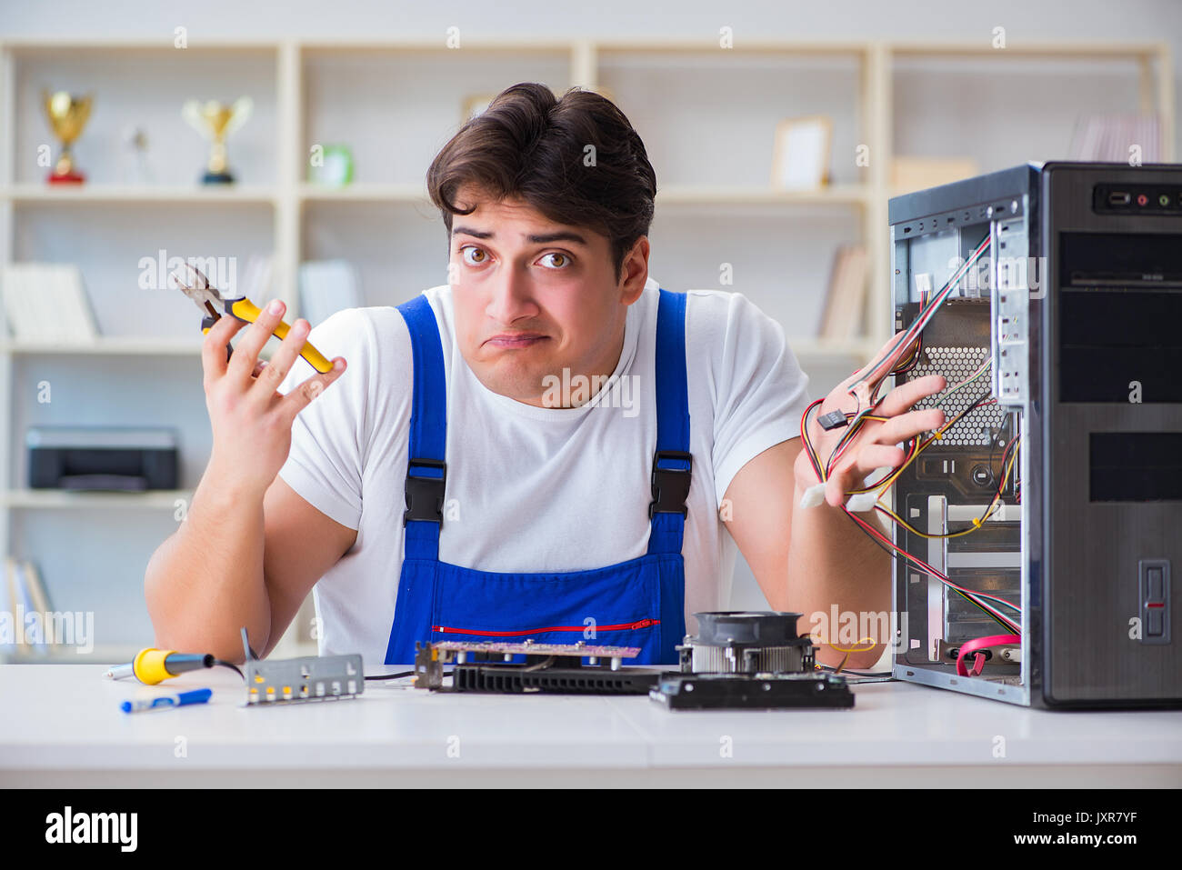 Computer repairman repairing desktop computer Stock Photo - Alamy