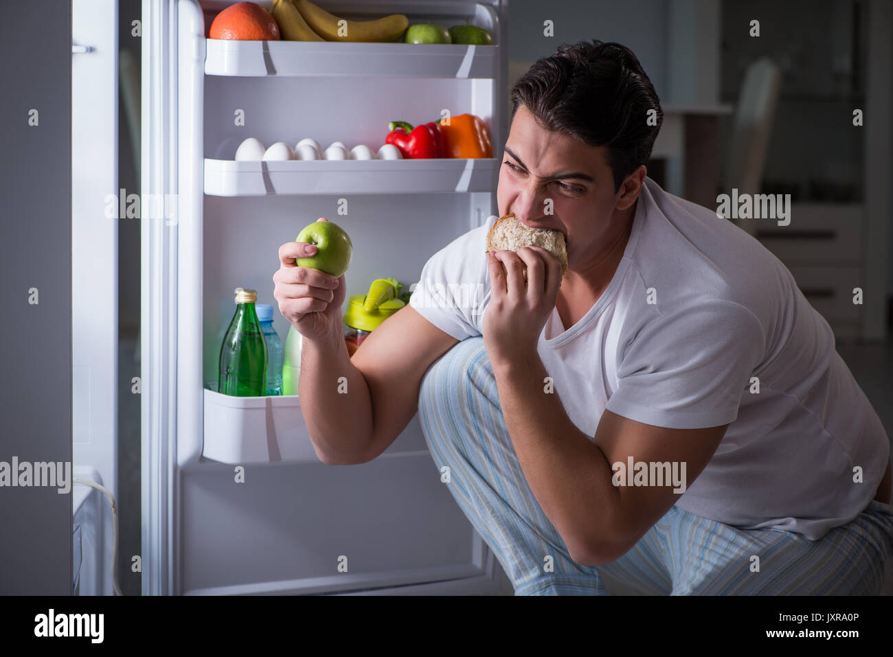 Man eating night sandwich hi-res stock photography and images - Alamy