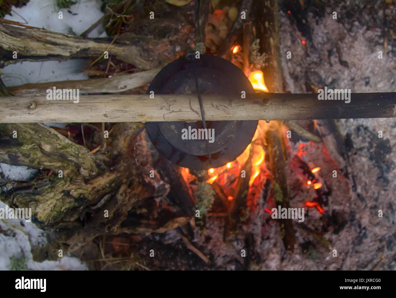 picnic in winter on nature of a bonfire. kettle for tea on coals Stock ...