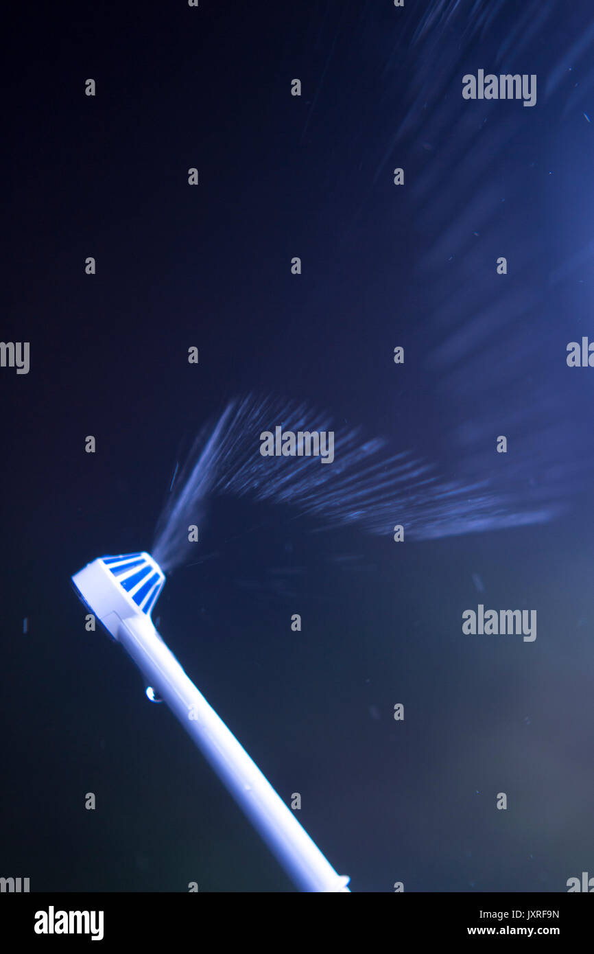 Dental water spray cleaner for interdental hygiene Stock Photo - Alamy