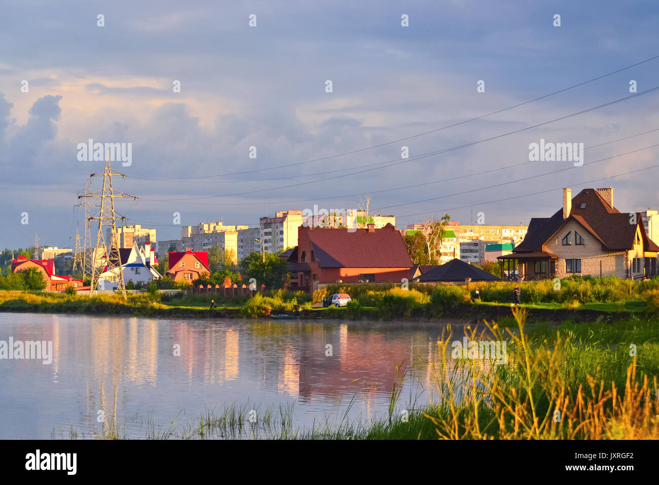 Bright city skyline with reflections in the river Stock Photo - Alamy