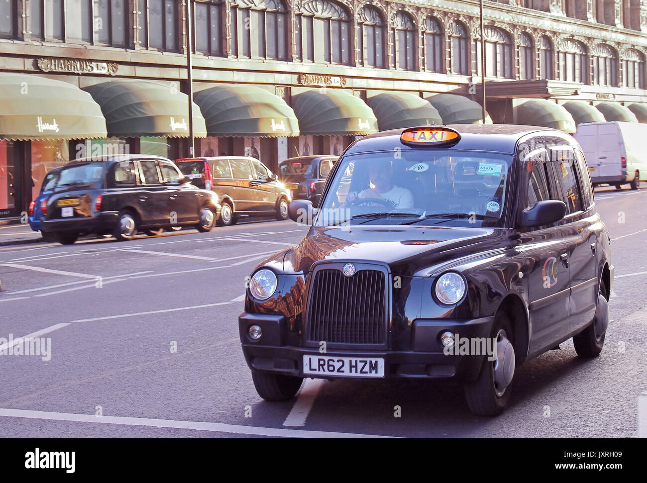 LONDON, UK - February 09: Traditional taxi service black cab car on ...