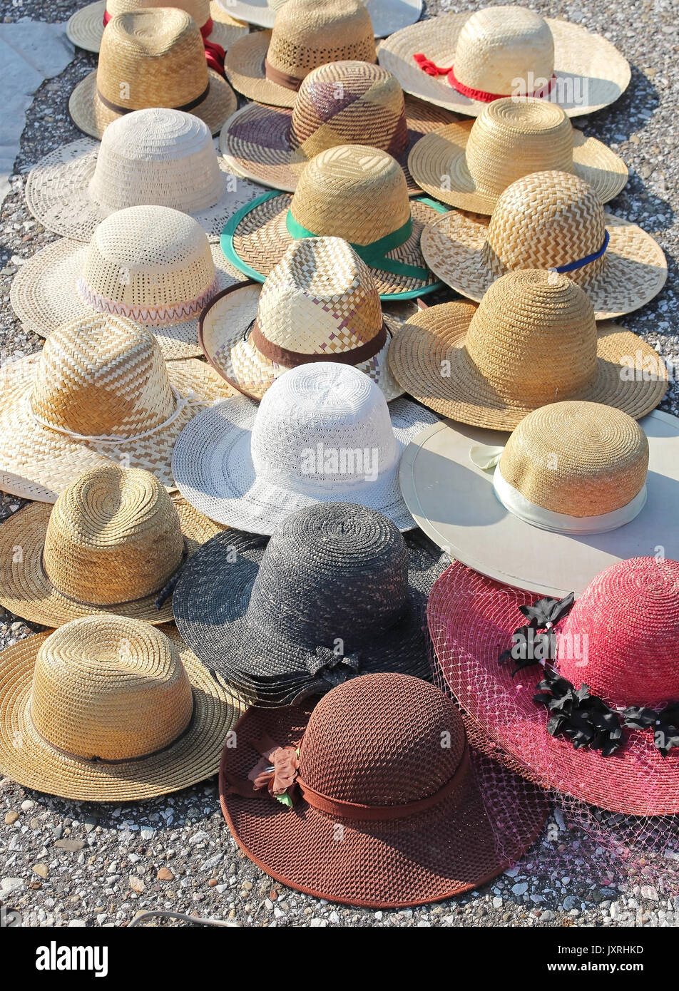 Summer straw hats on floor outside on the sun Stock Photo - Alamy