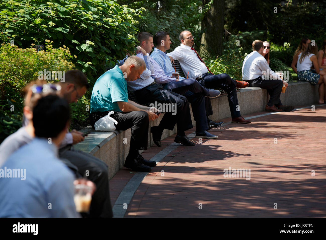 People office workers during lunch hour Post Office Square park Boston ...
