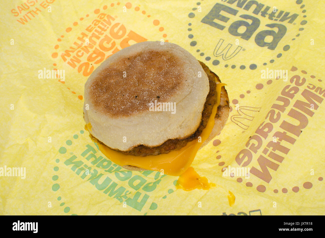 McDonald’s sausage and cheese McMuffin breakfast sandwich on paper ...