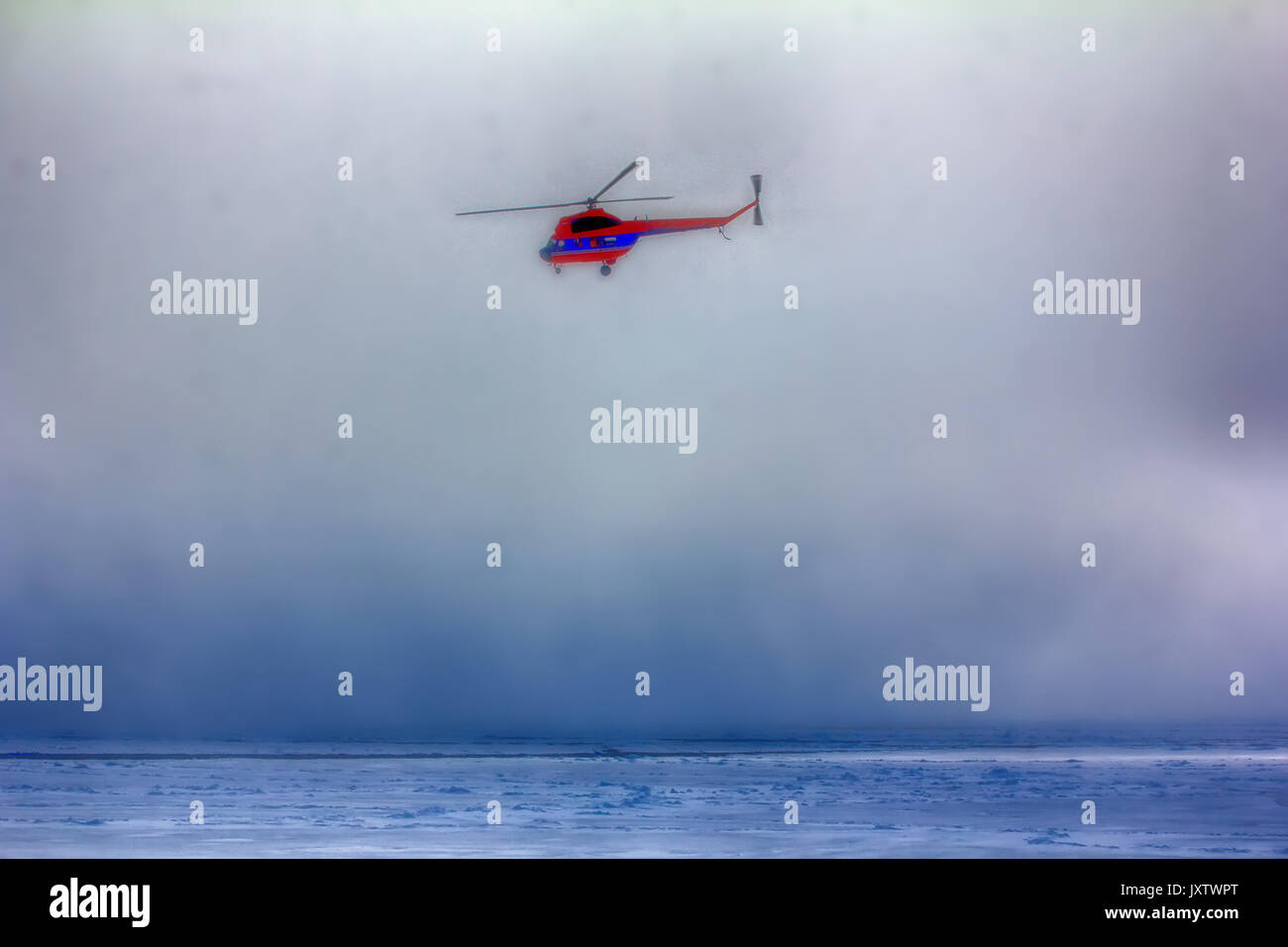 helicopter in fog at sea. air transport in bad weather conditions Stock ...