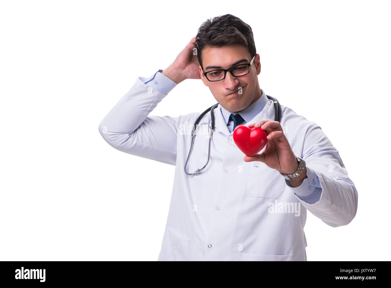 Young male cardiologist doctor holding a heart isolated on white ...