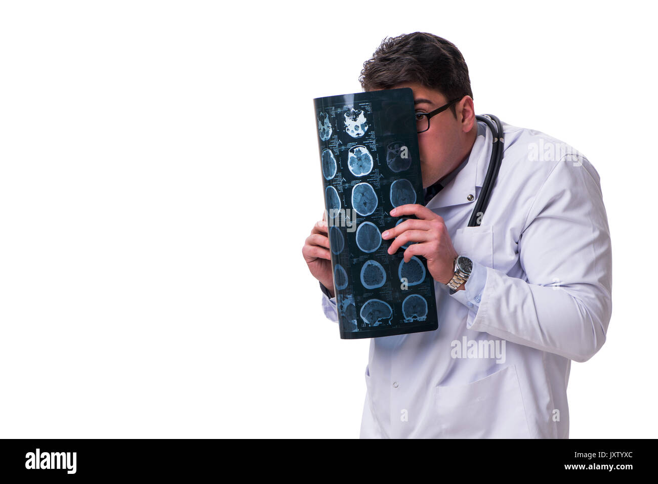 Young male doctor holding a radiograph isolated on white background ...