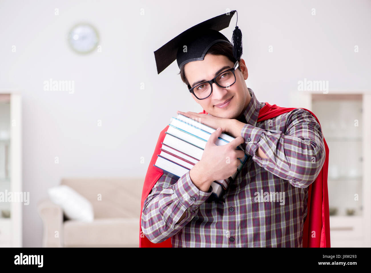 Super hero student with books studying for exams Stock Photo - Alamy
