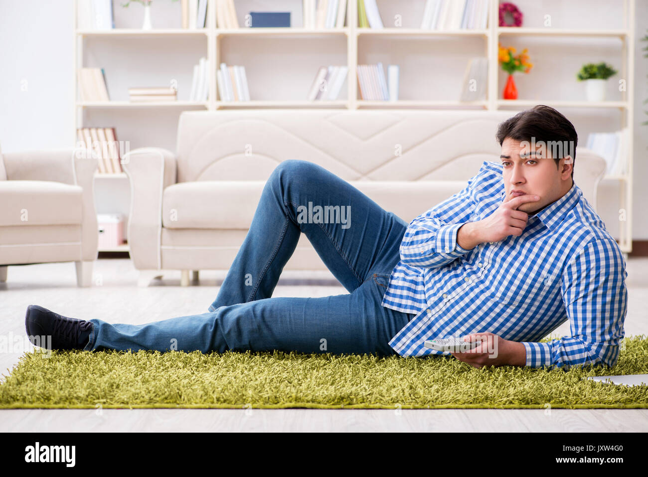Tired man laying on the floor at home hi-res stock photography and ...