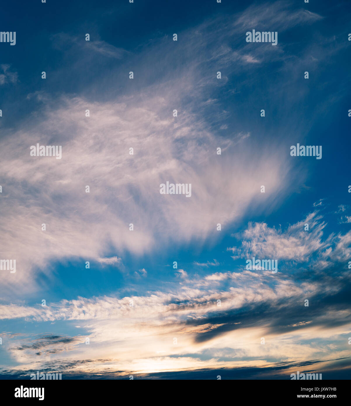 Wonderful sunset sky with different clouds. Vertical composition Stock ...