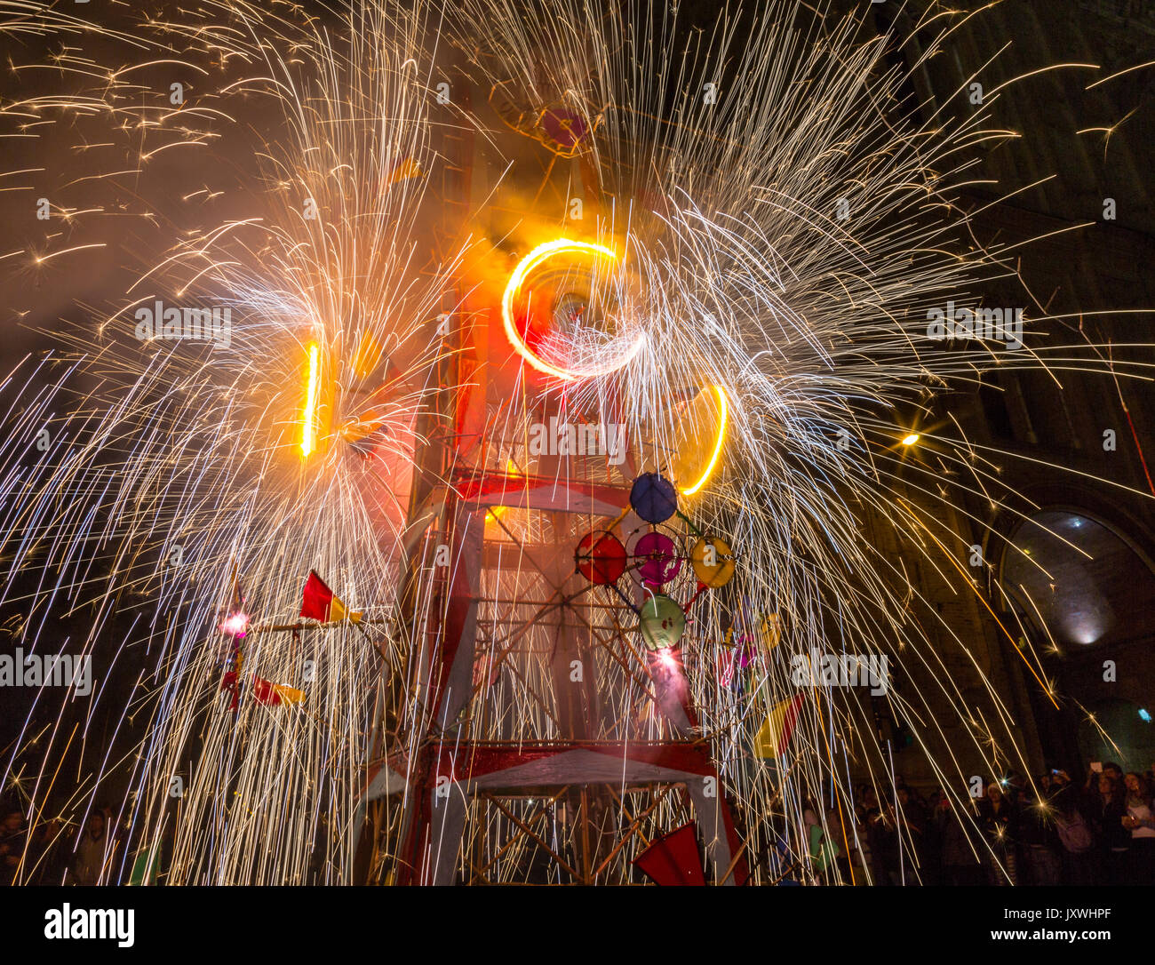 Bamboo towers are filled with various fireworks, and then lit within a ...